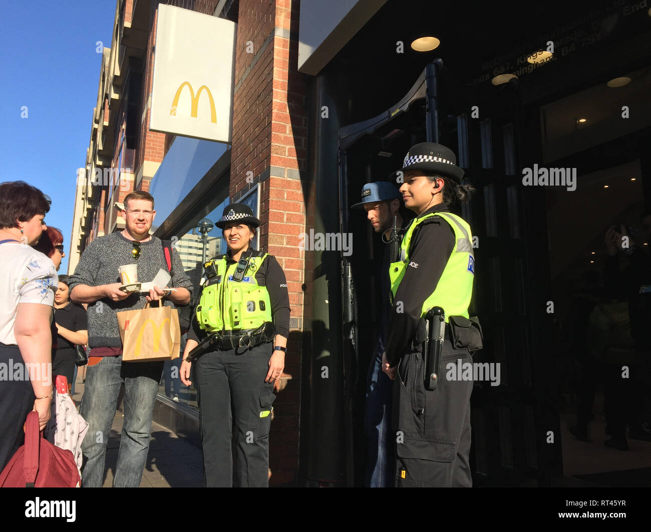 Police operate a knife arch at a McDonald's in Birmingham city centre ...