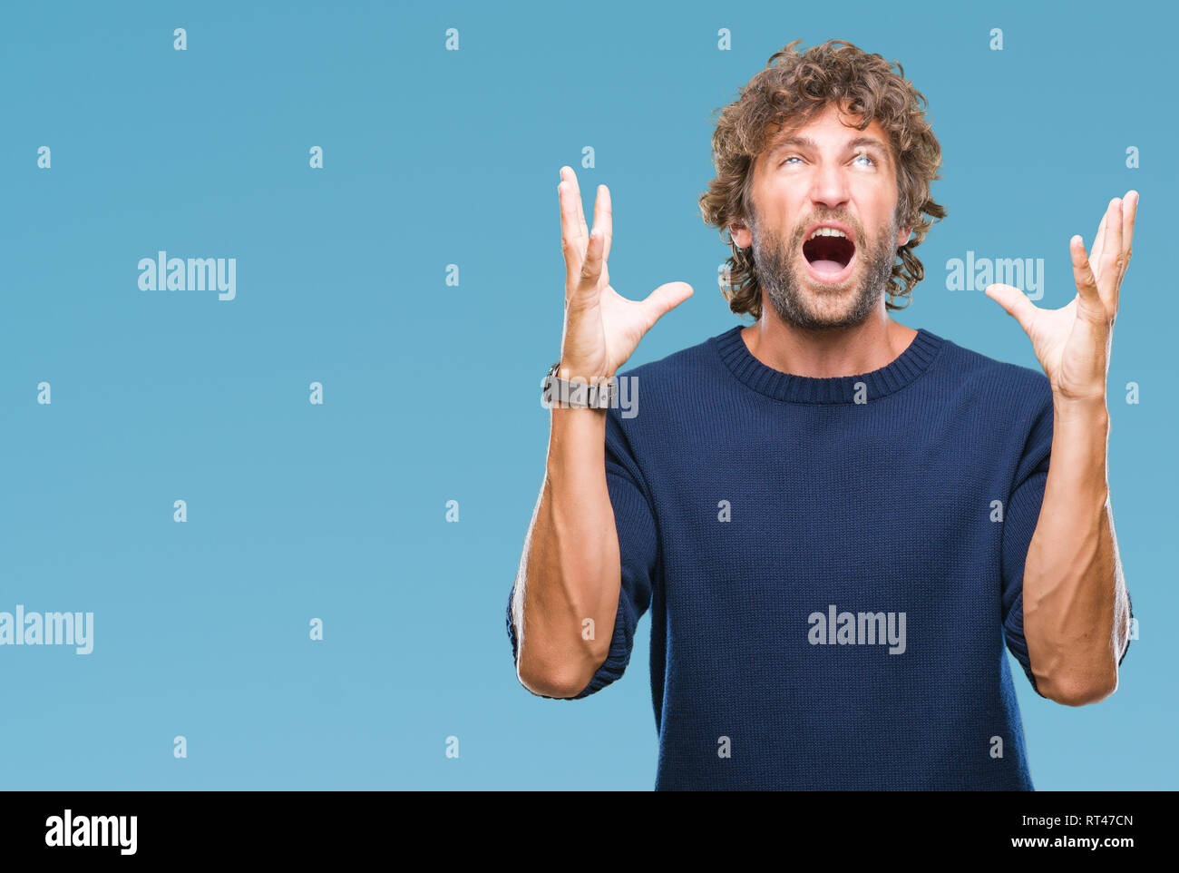 Handsome hispanic model man wearing winter sweater over isolated ...