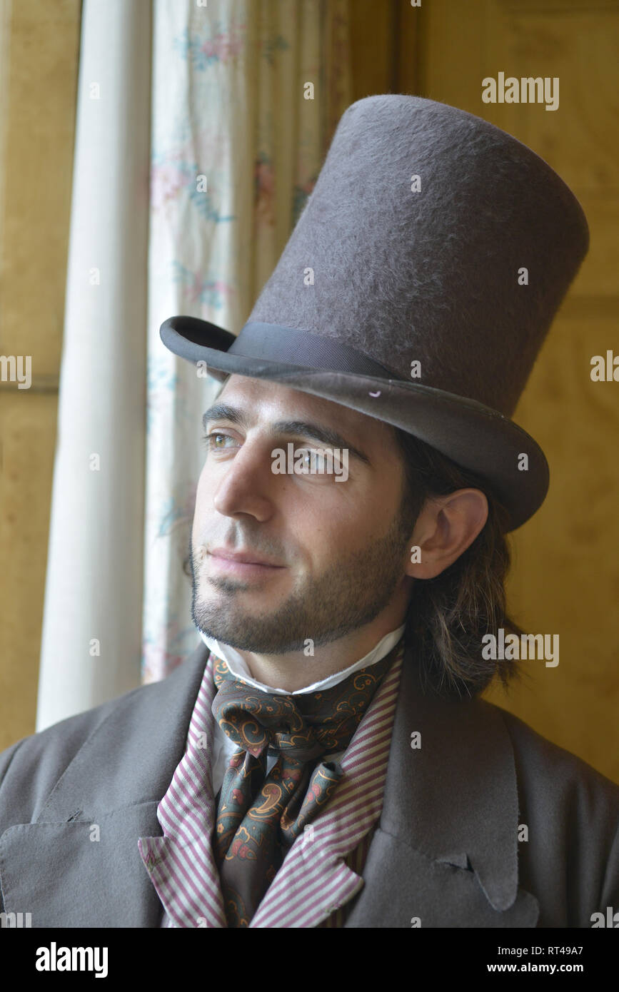 A handsome young Victorian man in a historically accurate suit stands ...