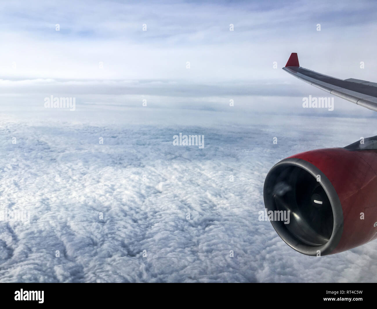 An aerial view from the airplane flying high above the ground. A look ...