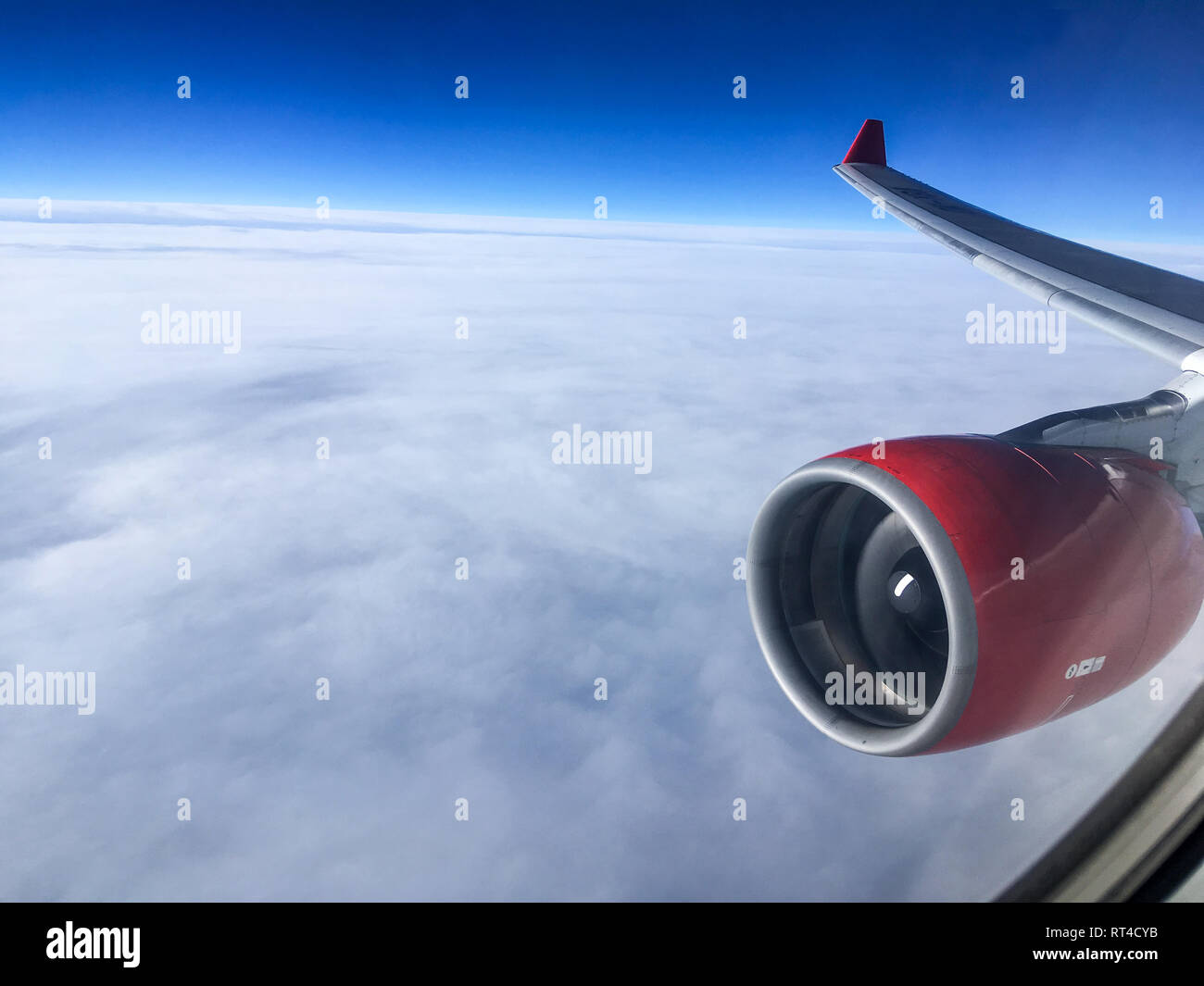 An aerial view from the airplane flying high above the ground. A look ...