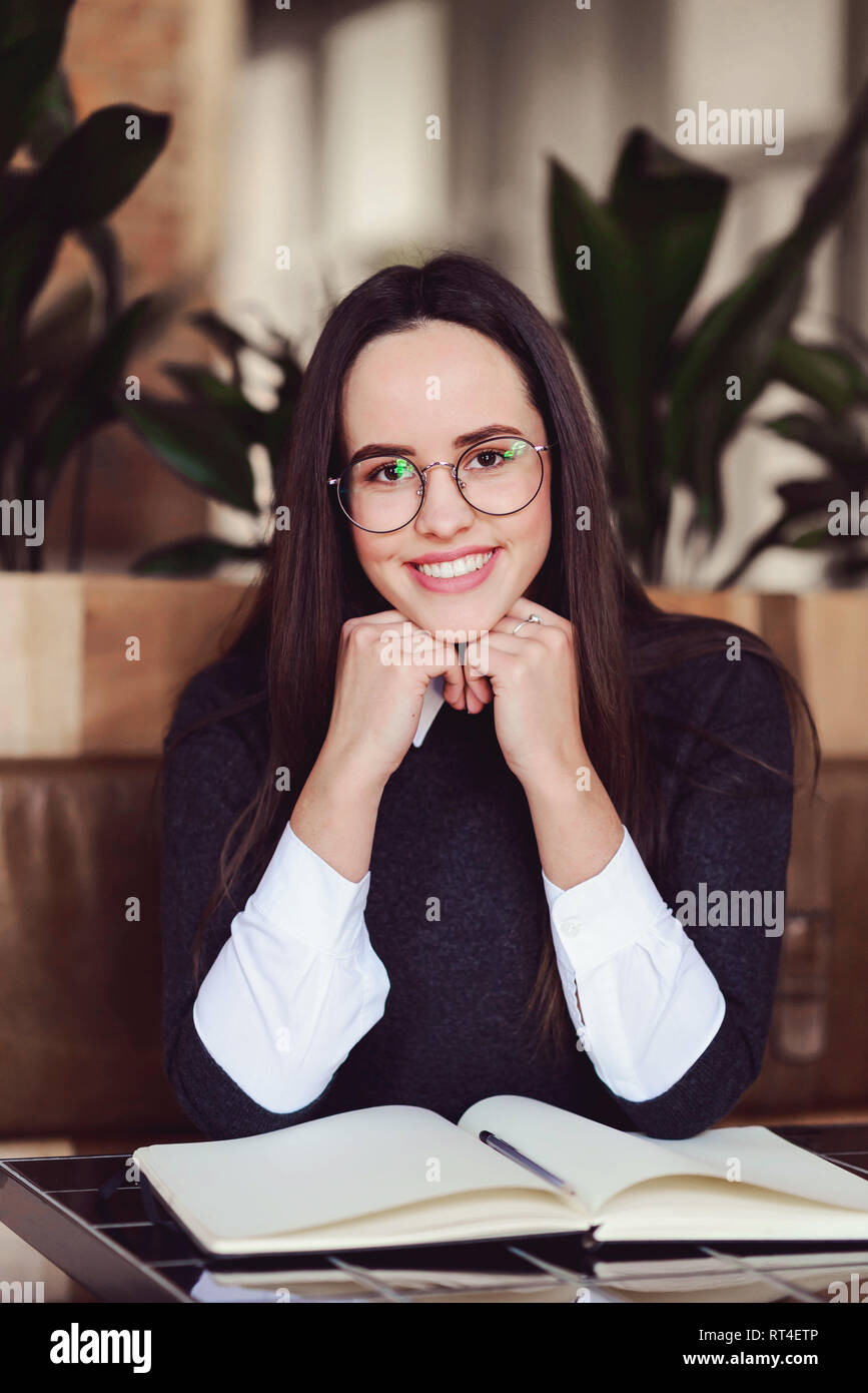 Beautifull girl grind away at the cafe interior Stock Photo - Alamy