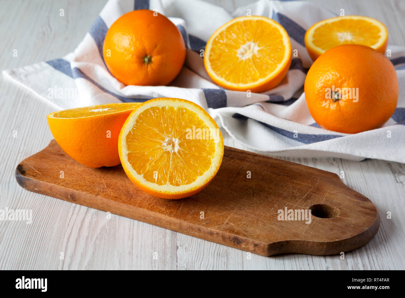 Halved and whole oranges, side view. Close-up Stock Photo - Alamy