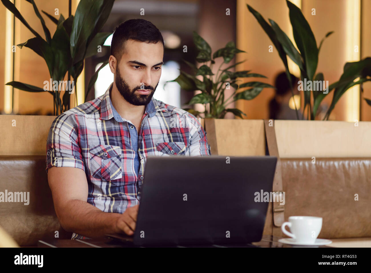 Person wearing plaid shirt hi-res stock photography and images - Alamy