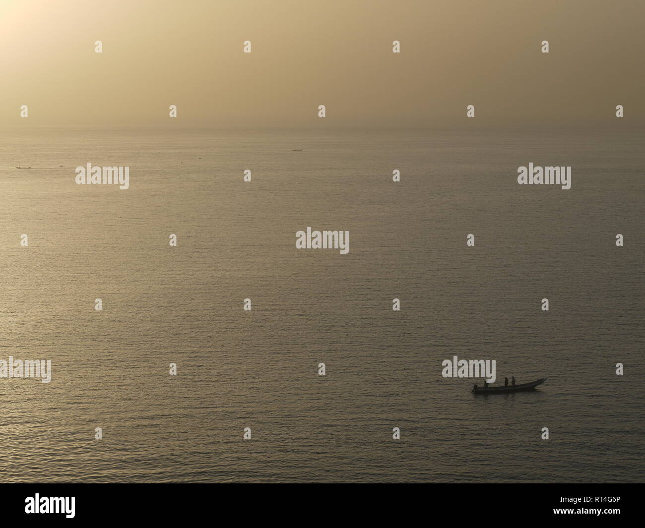 Fisherman's canoe on the ocean facing the Senegalese coast Stock Photo ...