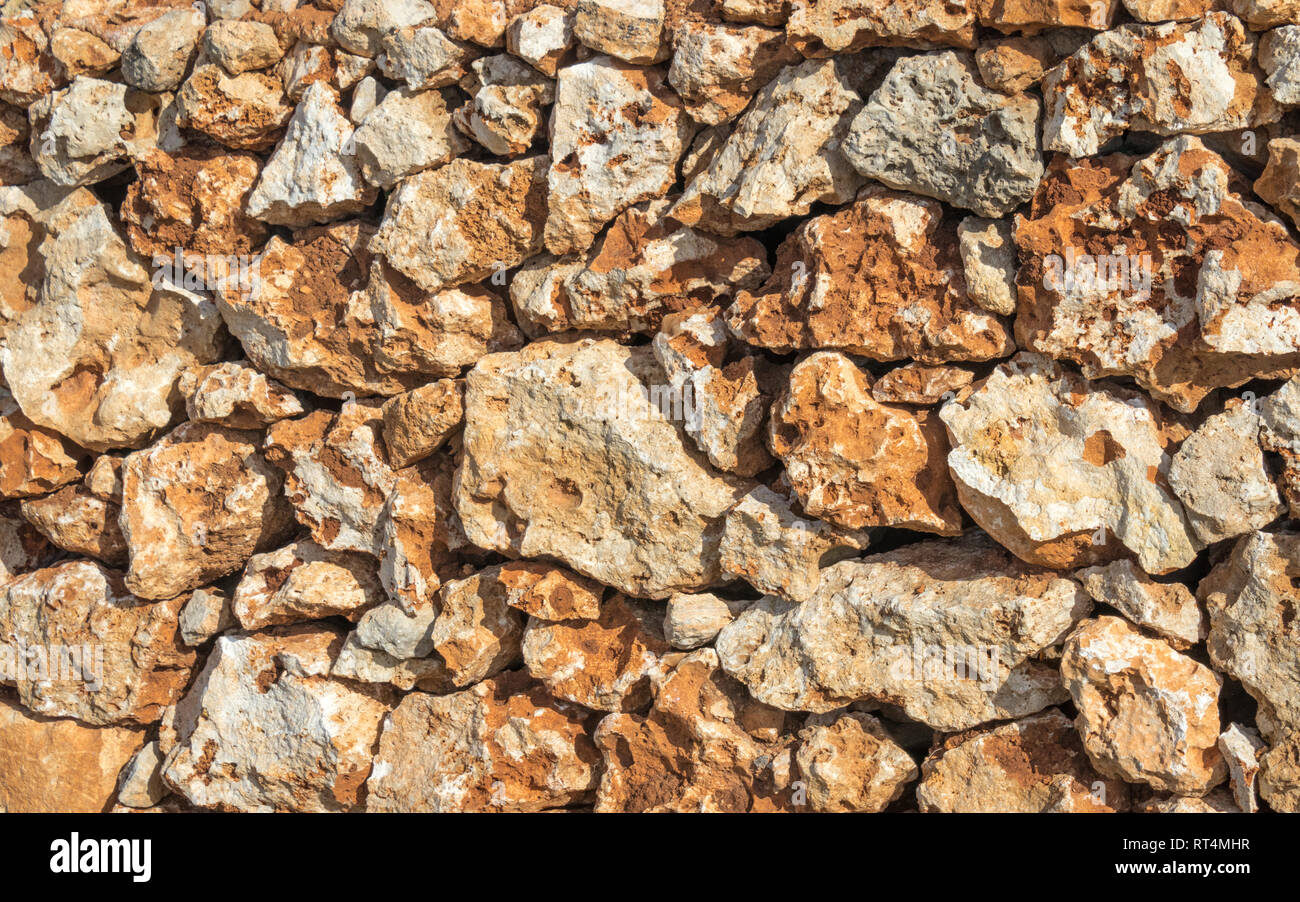 Wall of sand stones on Malta Stock Photo - Alamy