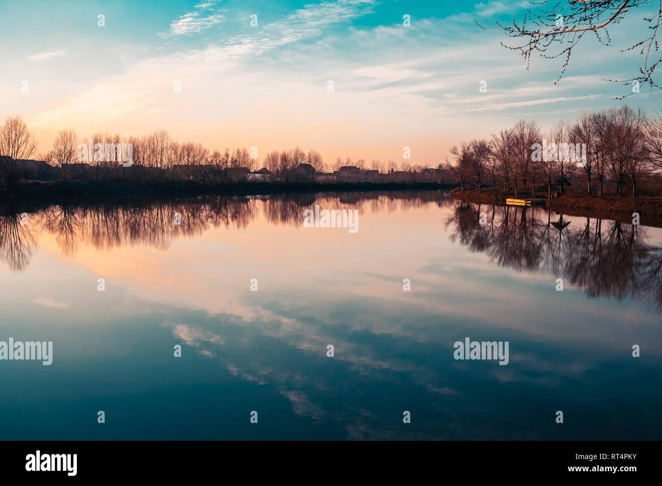 Sunset over water Stock Photo - Alamy