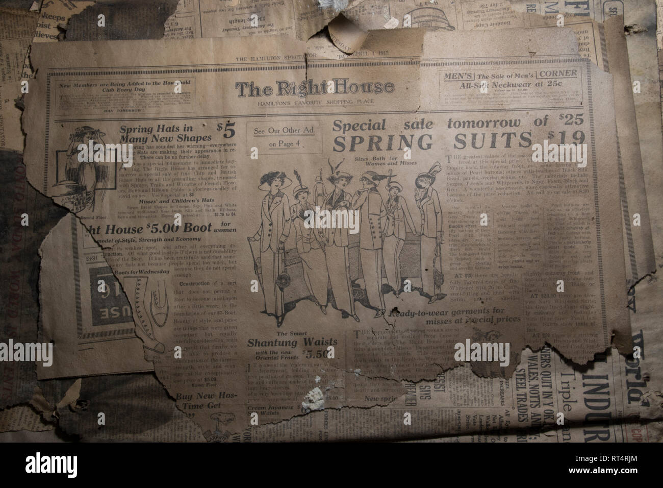 Clothing advertisements in 100 year old newspaper. Torn and yellowed ...