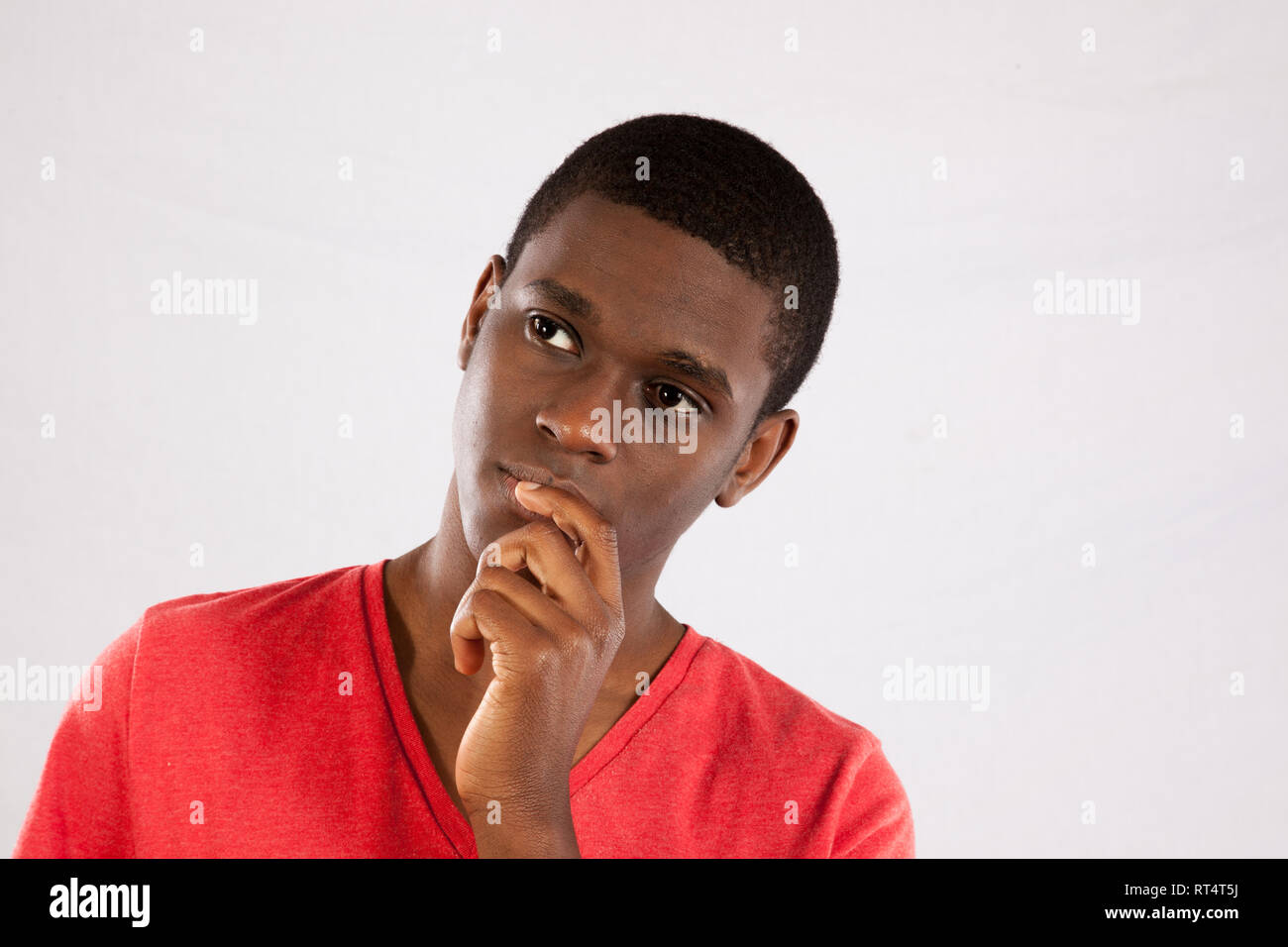 Thoughtful Black man looking seriouis Stock Photo - Alamy
