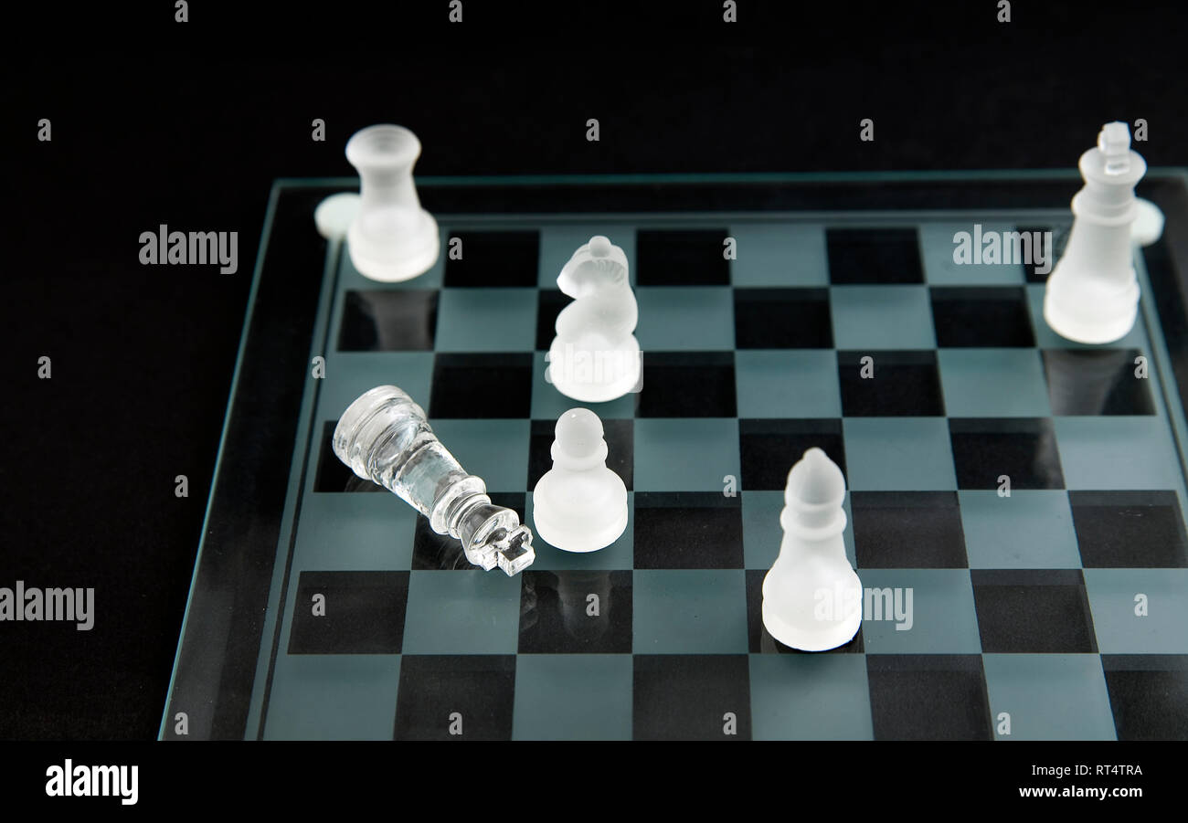 glass chess - dead king lying on the chessboard Stock Photo - Alamy