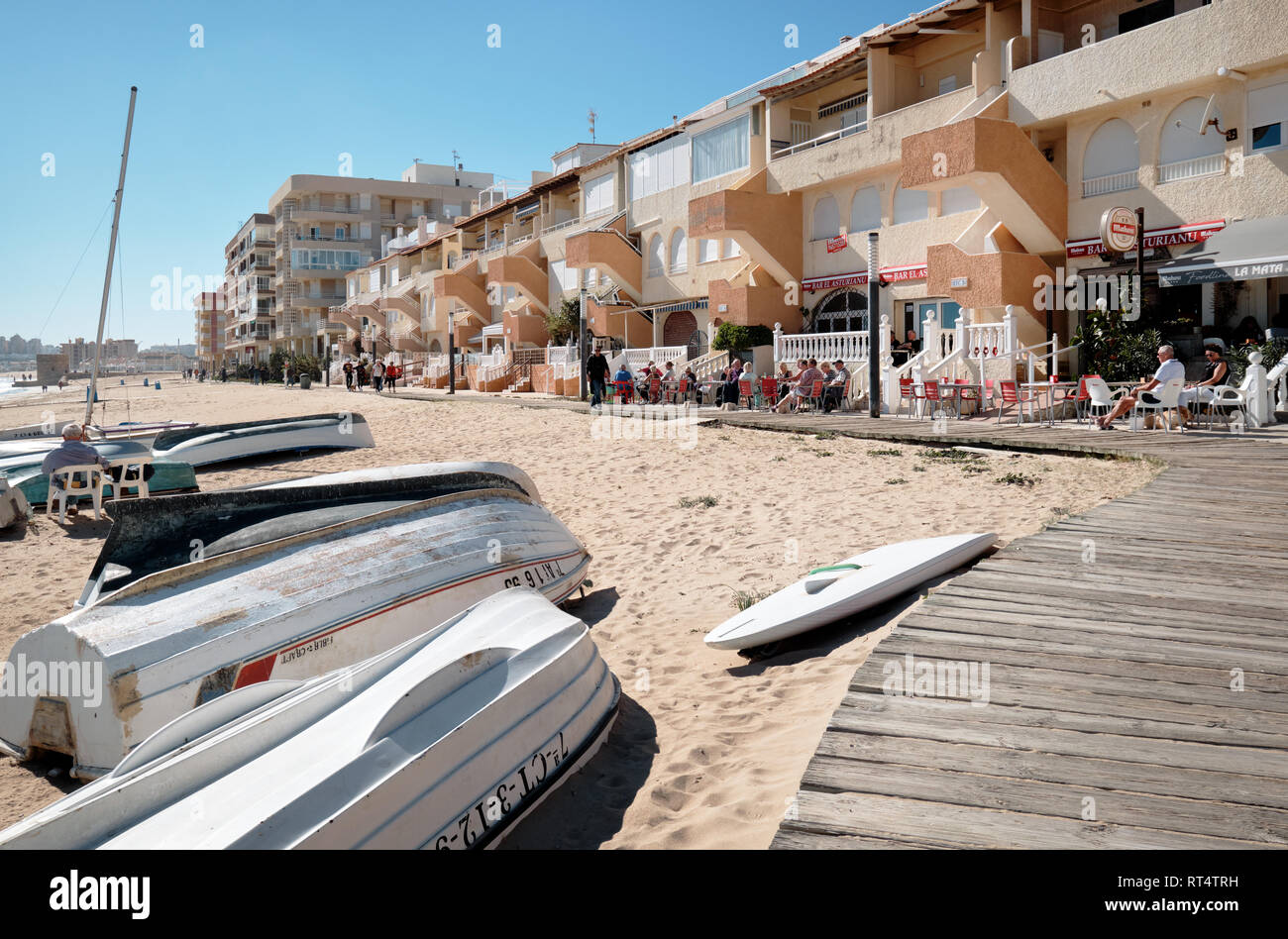 La Mata, Spain - February 5, 2019: Inverted fishing boats on the sandy ...