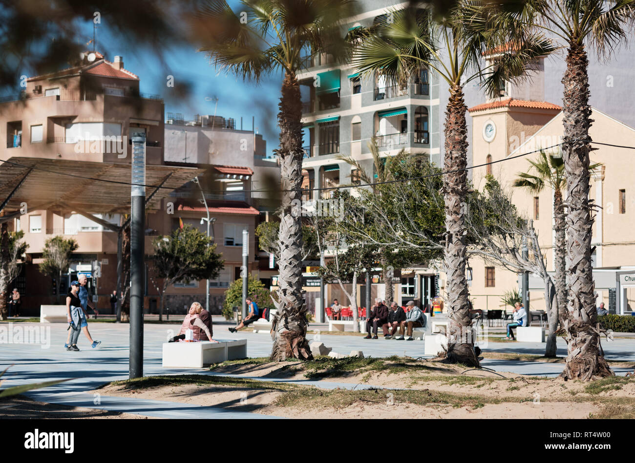 La Mata, Spain - February 5, 2019: Central square full of walking ...
