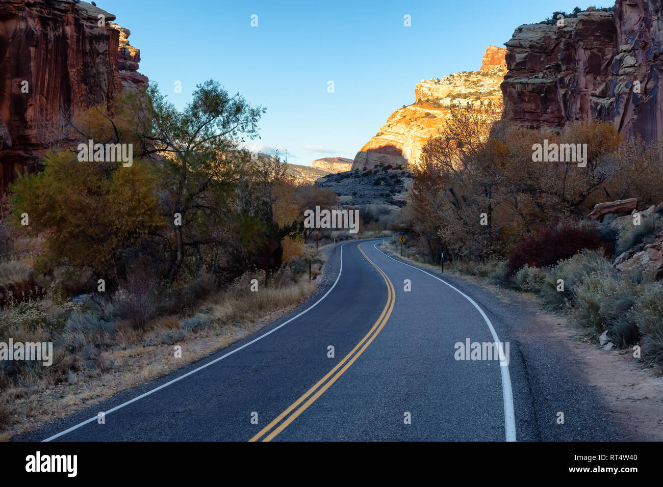 Scenic road in the desert during a vibrant sunny sunrise. Taken on ...