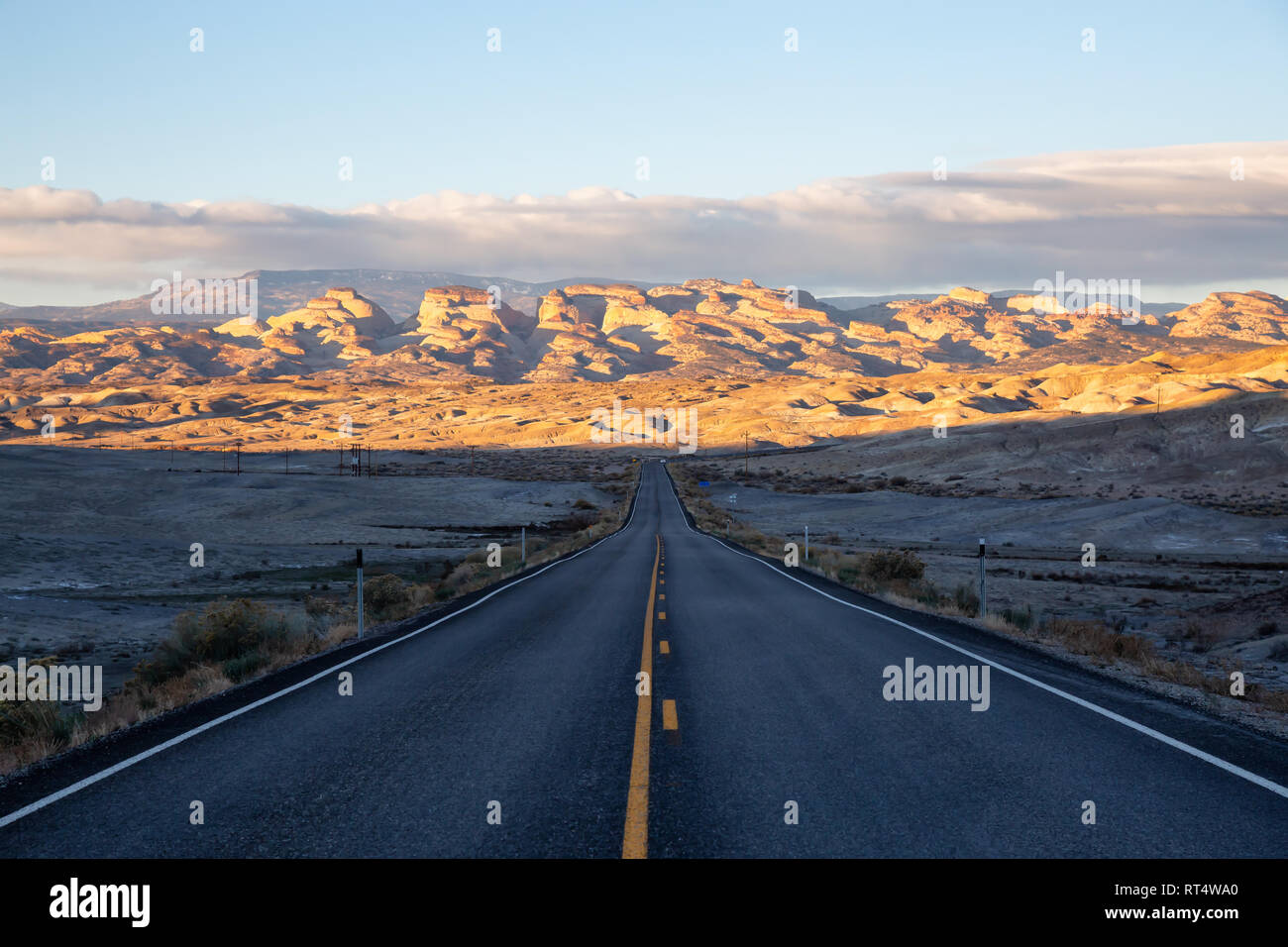 Scenic road in the desert during a vibrant sunny sunrise. Taken on ...