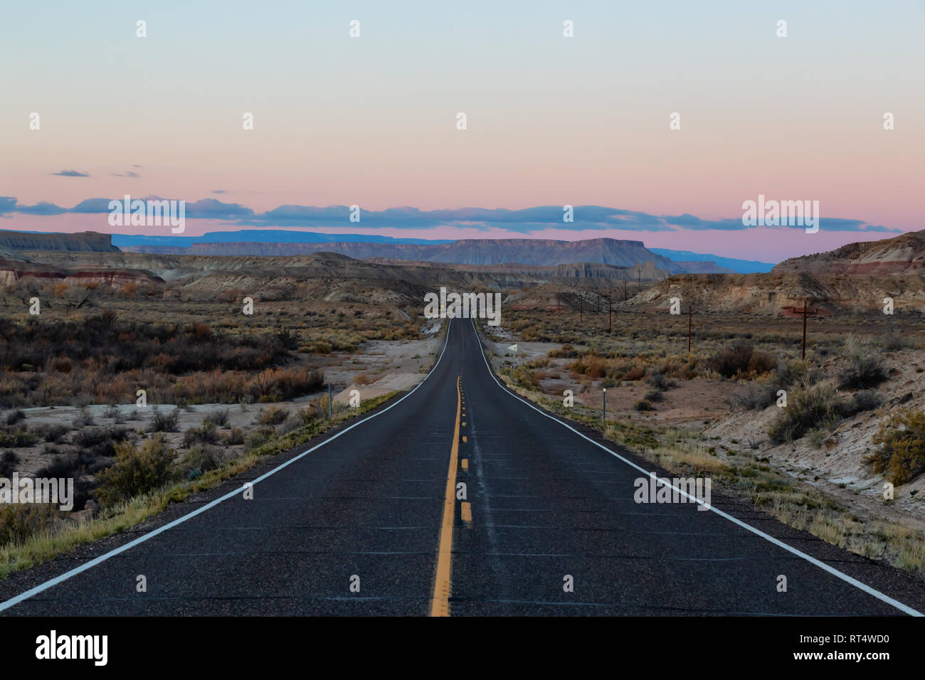 Scenic road in the desert during a vibrant sunny sunrise. Taken on ...