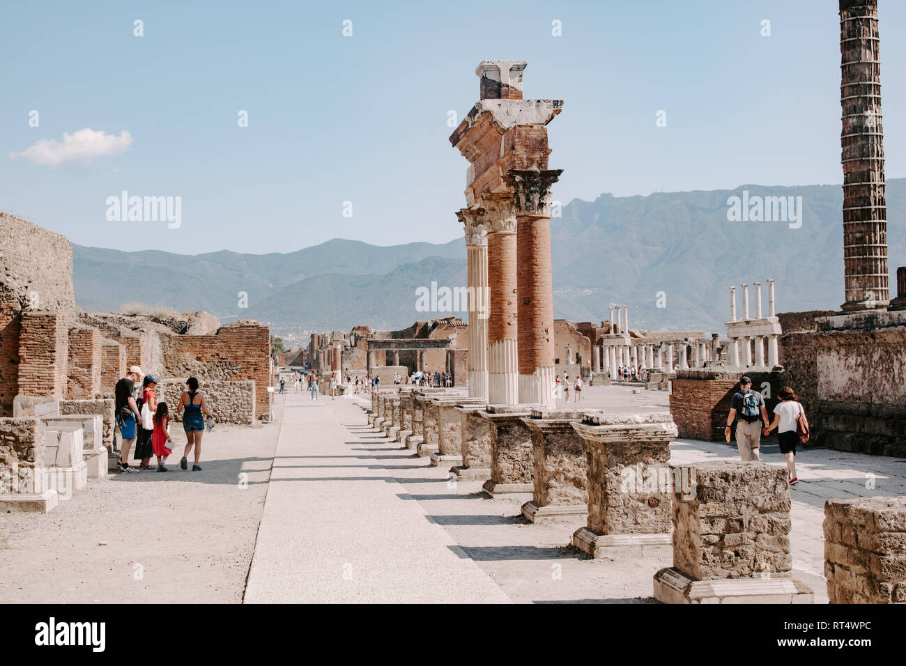 Tourists visiting Roman Forum, Colonnade, Pompeii, travel Italy ...