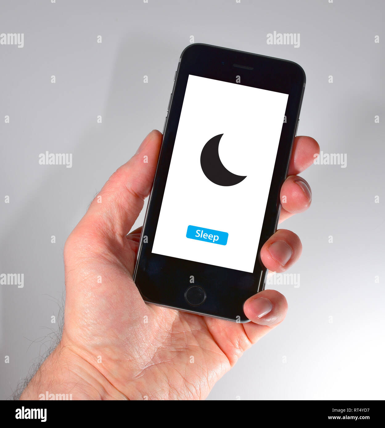 iPhone held in hand - sleep mode symbol Stock Photo - Alamy
