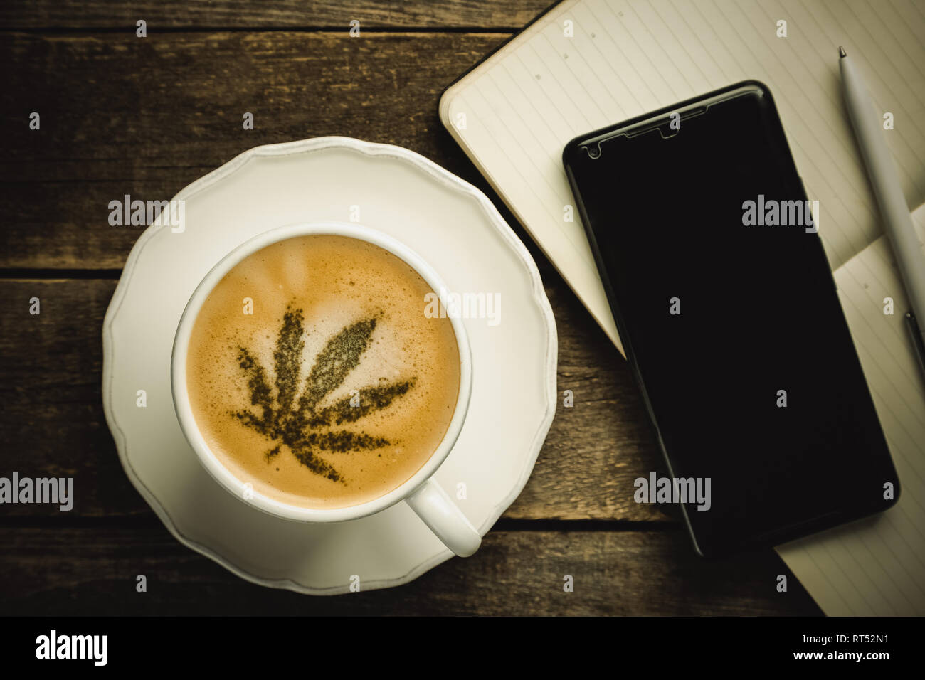 Cannabis coffee - marijuana leaf on coffee foam Stock Photo - Alamy