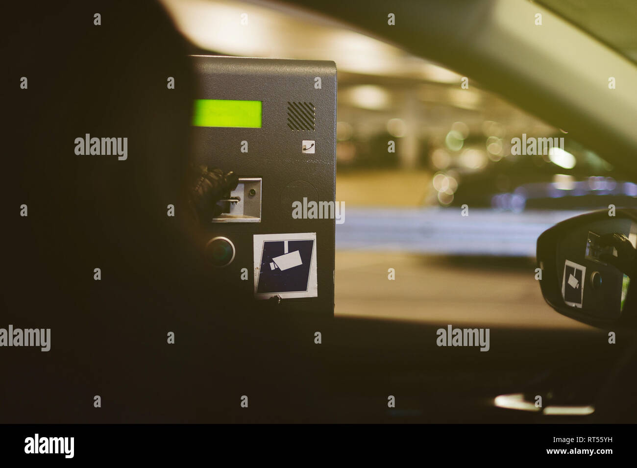 Woman taking parking meter ticket slip from the automated distribution ...