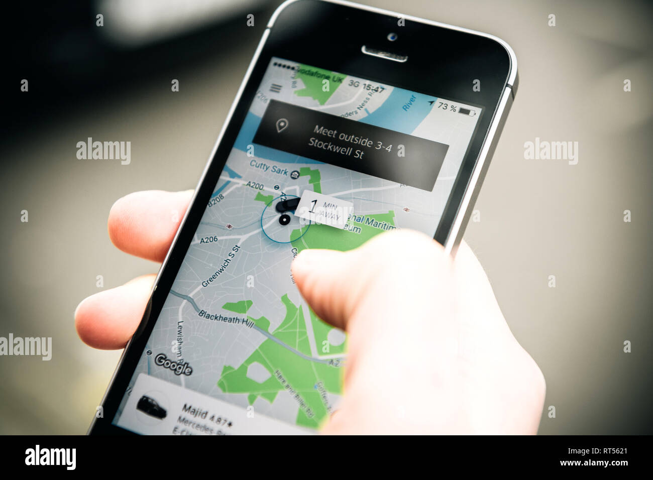 GREENWICH, LONDON, UNITED KINGDOM - MAR 10 2017: Woman waiting for the ...