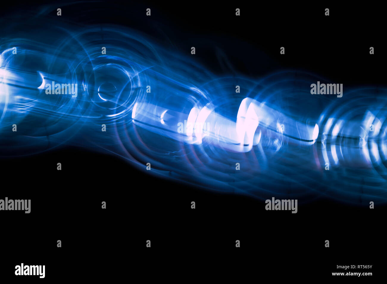 Sound waves in the visible blue color in the dark Stock Photo - Alamy