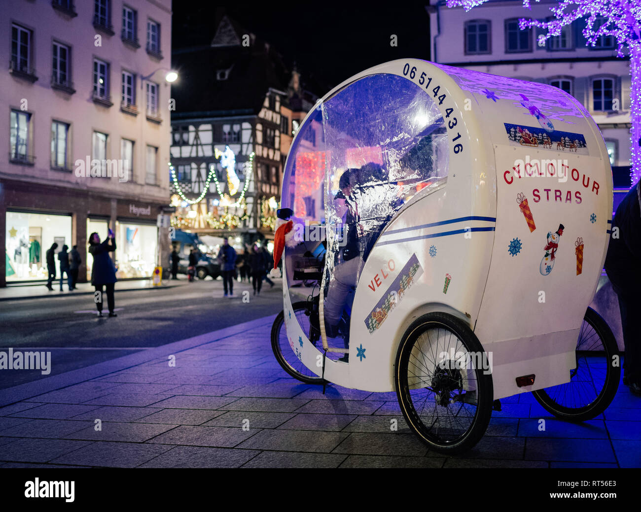 STRASBOURG, FRANCE - NOV 29, 2017: Rickshaw green transportation at ...