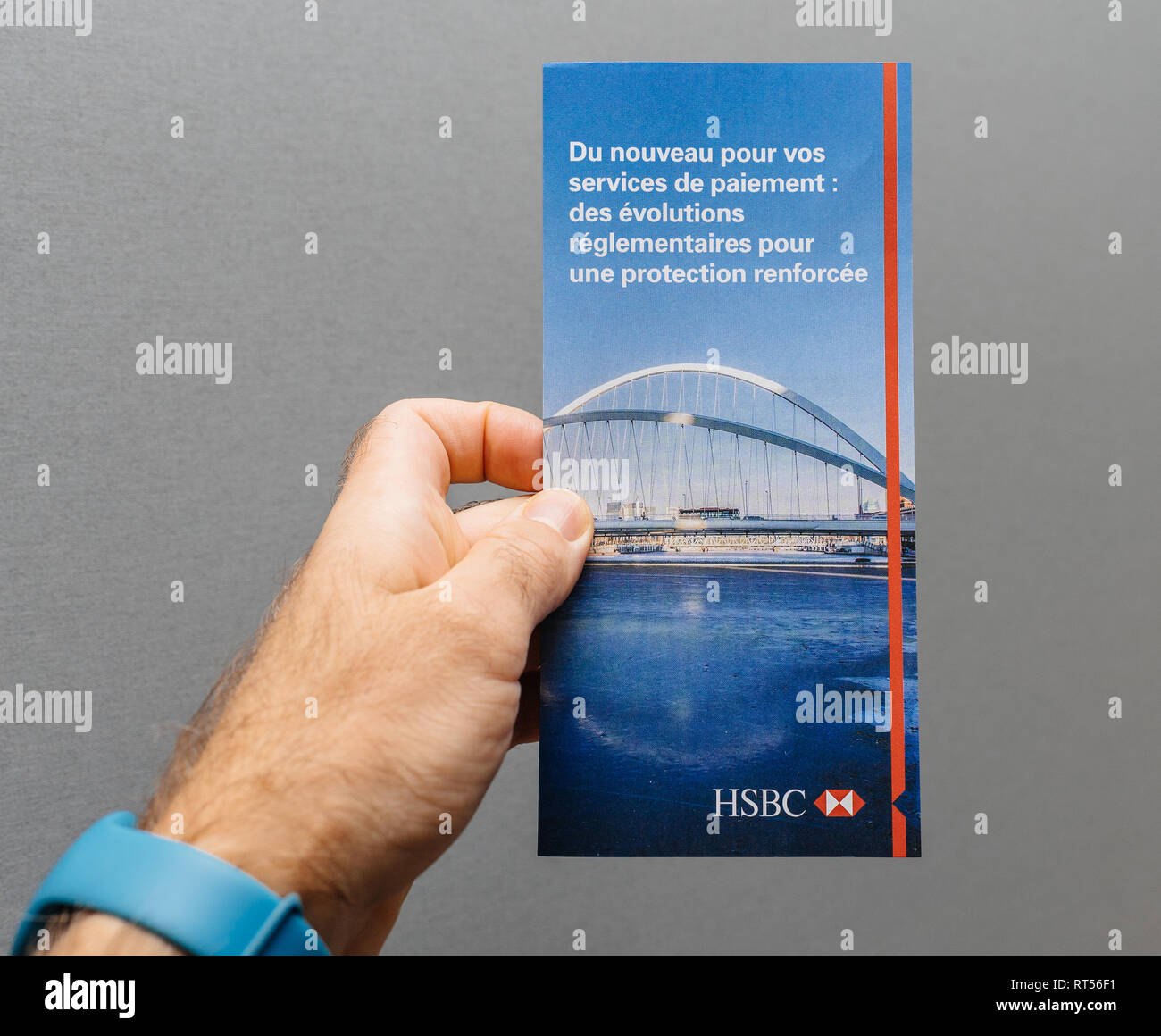 PARIS, FRANCE - NOV 28, 2017: Man hand holding HSBC bank flyer ...