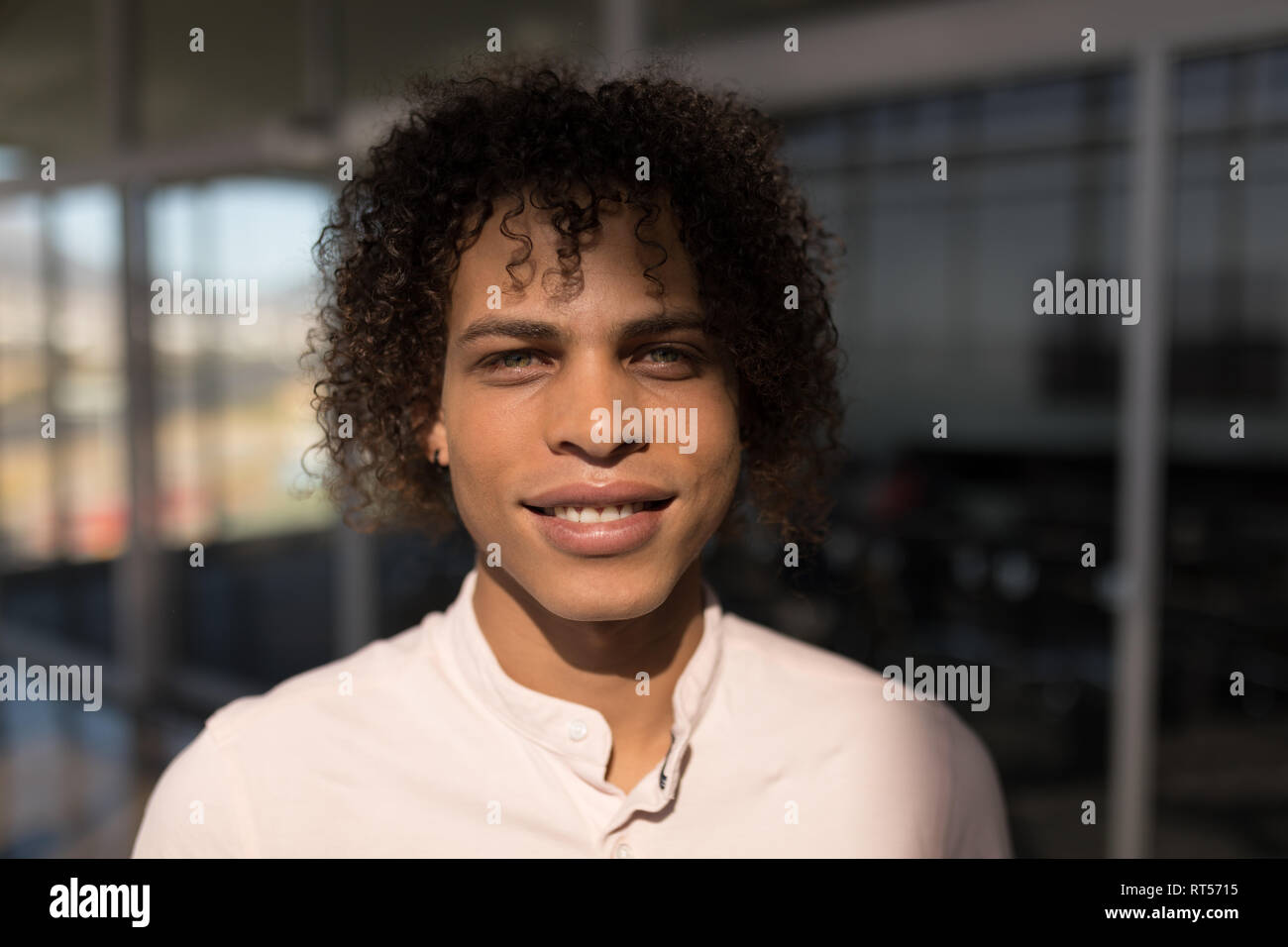Male executive standing in the office Stock Photo - Alamy