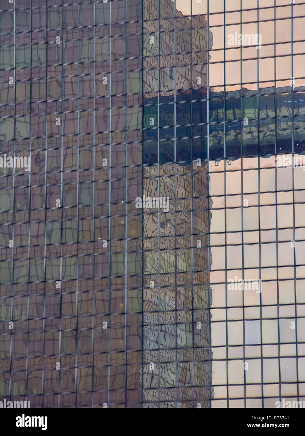 A building of rectangular glass windows with reflections Stock Photo ...