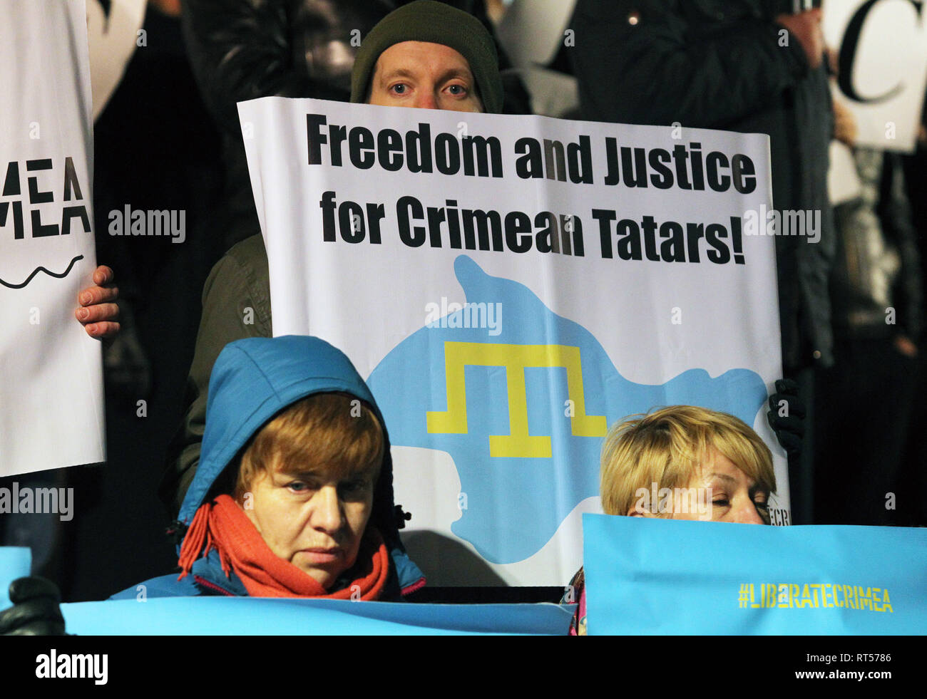 A Ukrainian seen holding a placard saying, freedom and justice for ...