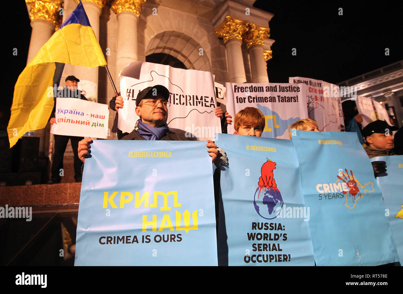 Ukrainians seen holding placards during the rally. Ukrainians rally ...
