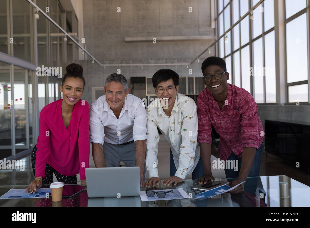 Business colleagues working together in office Stock Photo - Alamy