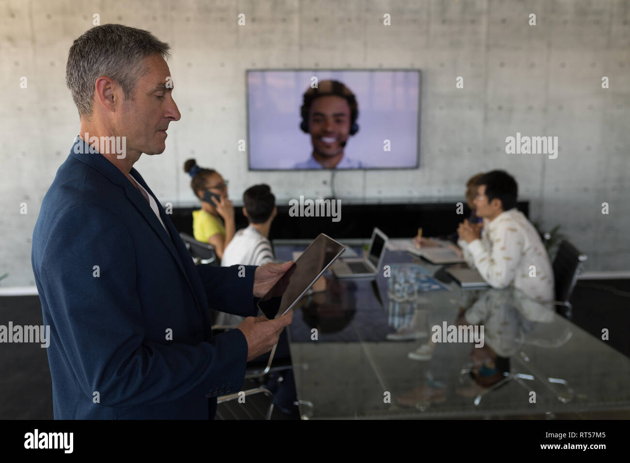 Business team working together on a video call in board room Stock ...