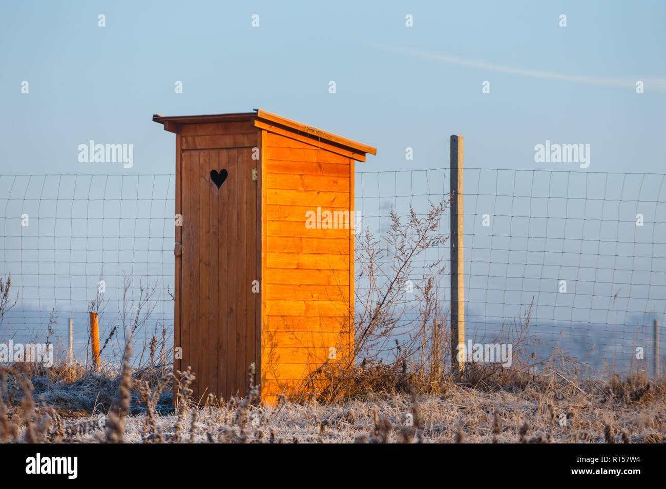An old wooden toilet building at sunrise Stock Photo - Alamy