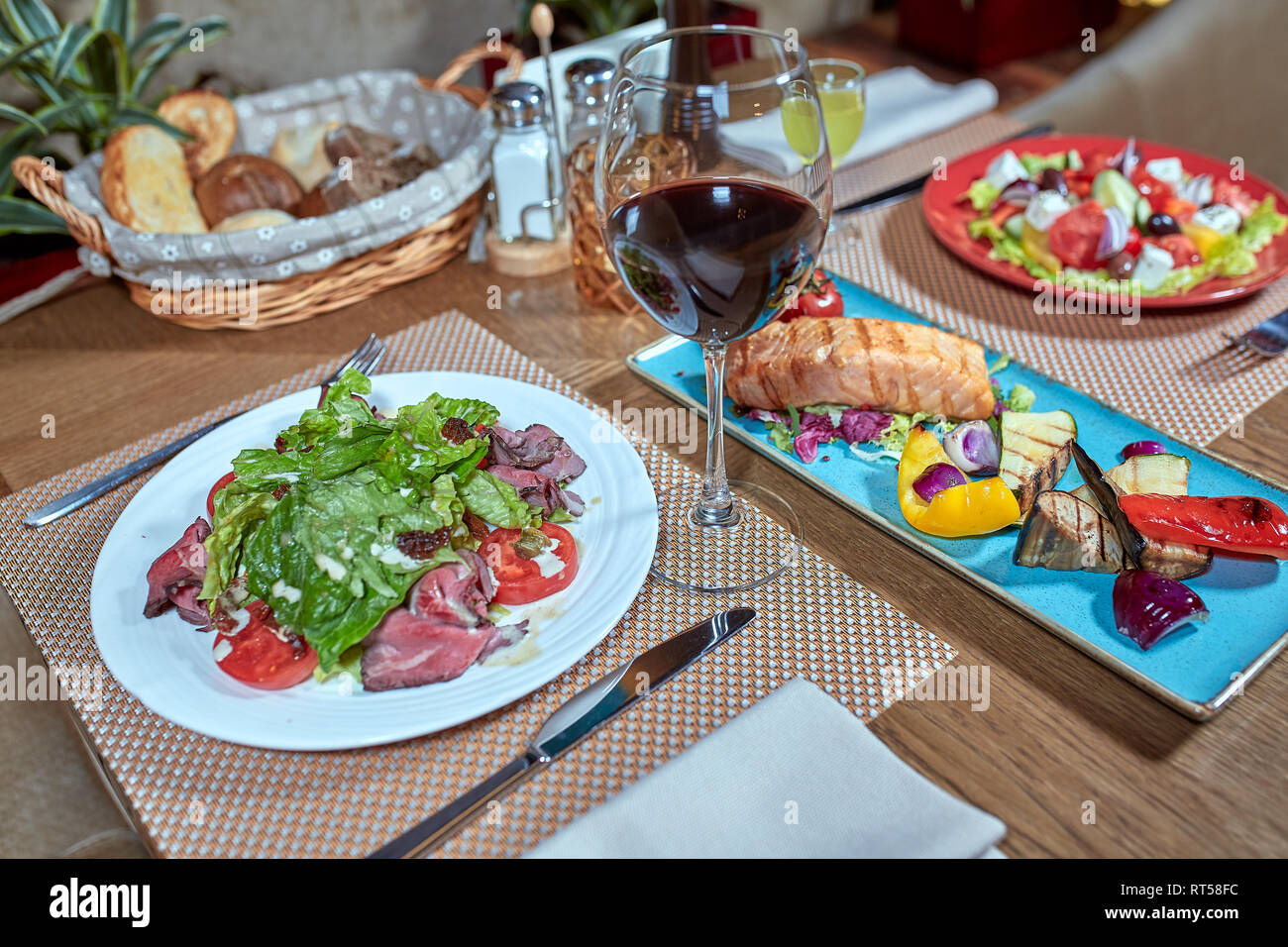 catering table set service with silverware and glass stemware at ...
