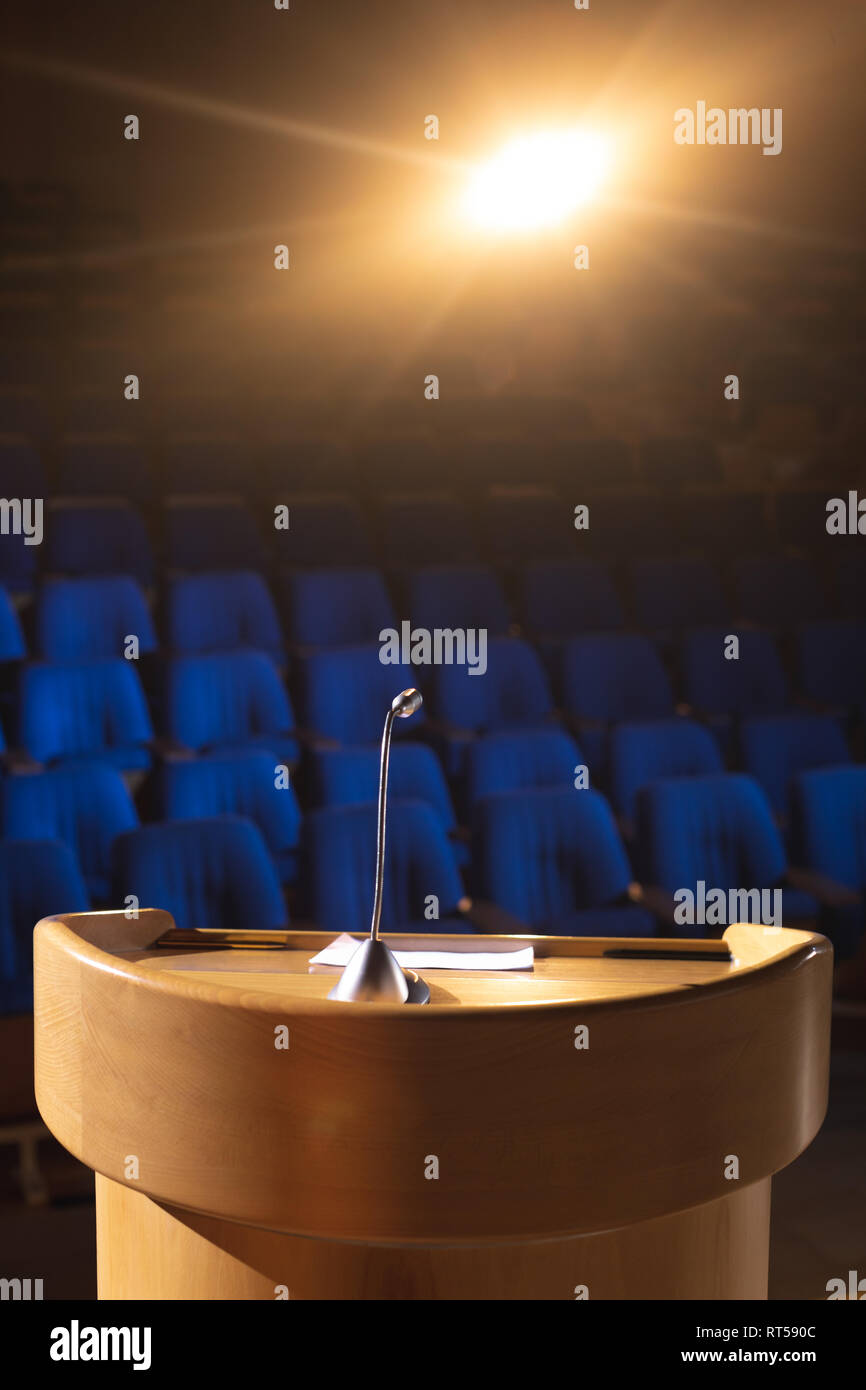 Empty auditorium with podium and speaker on stage Stock Photo - Alamy