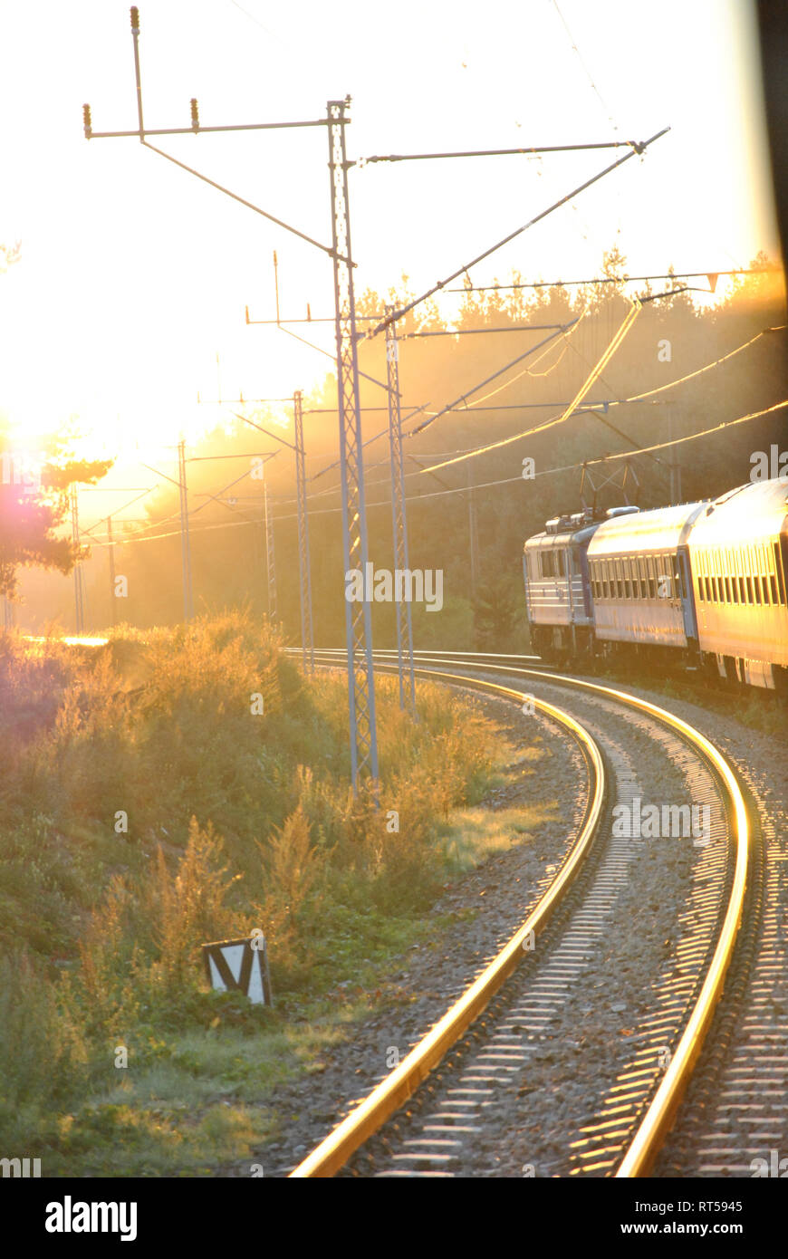 Train going towards the rising sun Stock Photo - Alamy