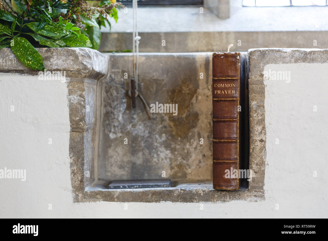 Detail of an ancient Church of England church with an old book of ...