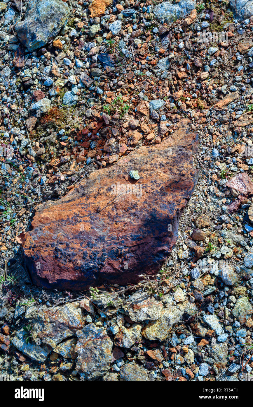 iron ore lies on the surface of the earth near a deposit in the Ural ...