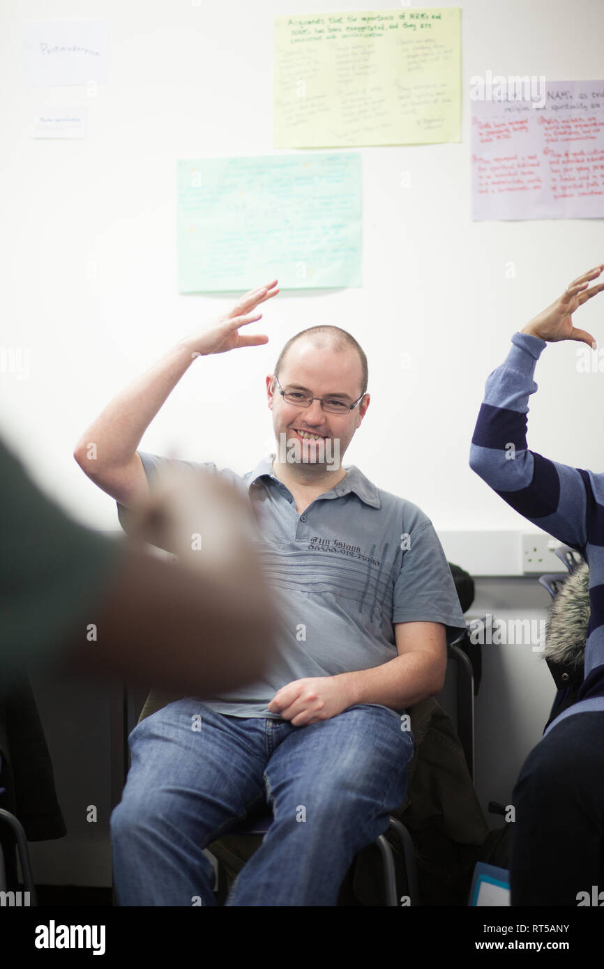 adults in a further education college learning how to use sign language ...