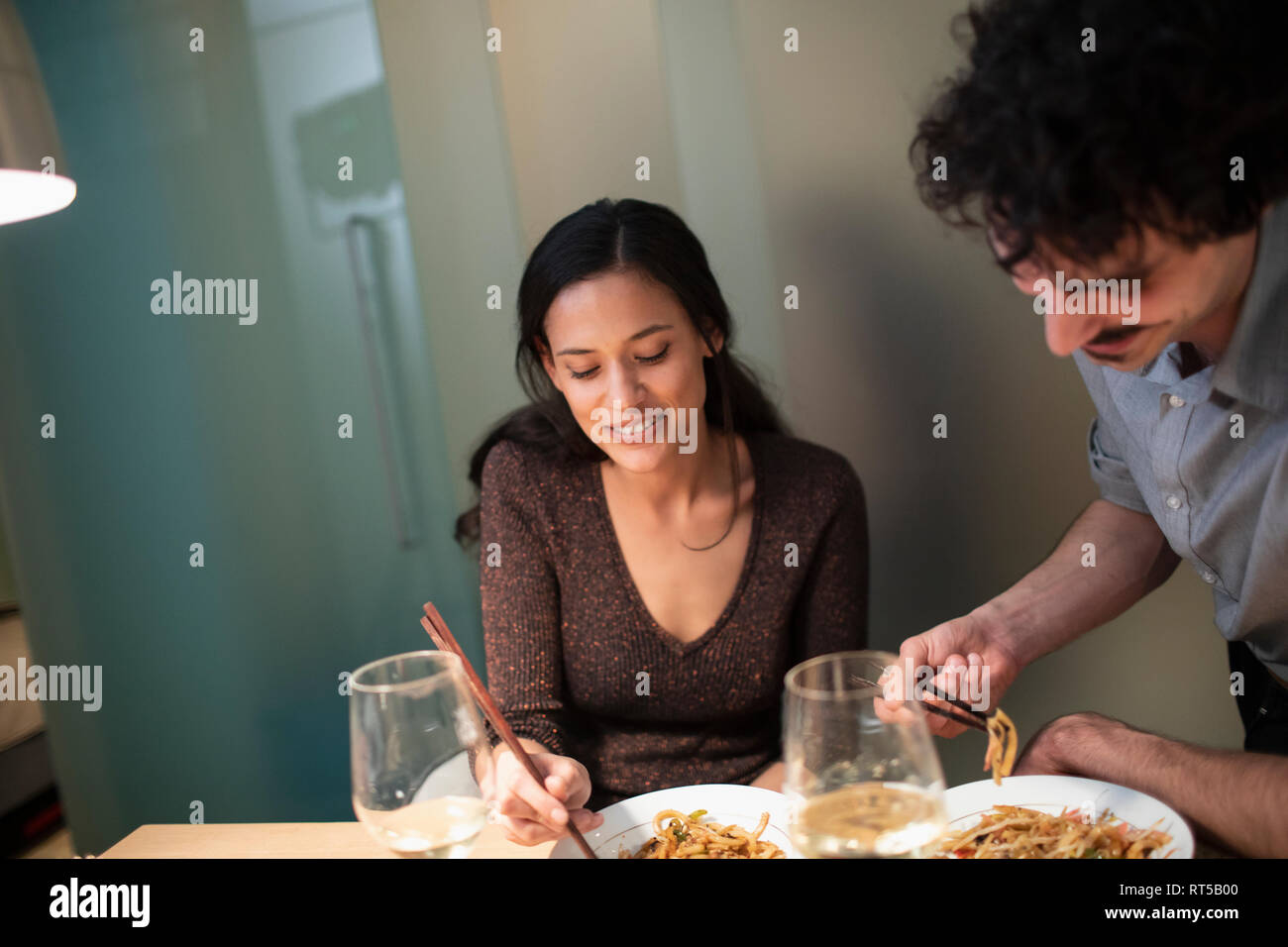 Couple eating food standing hi-res stock photography and images - Alamy