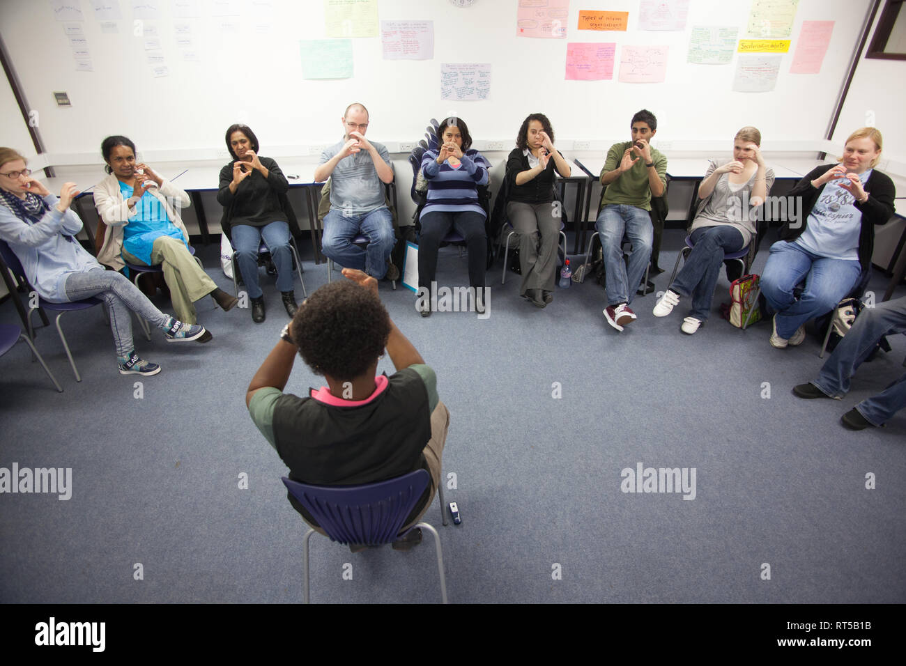 adults in a further education college learning how to use sign language ...