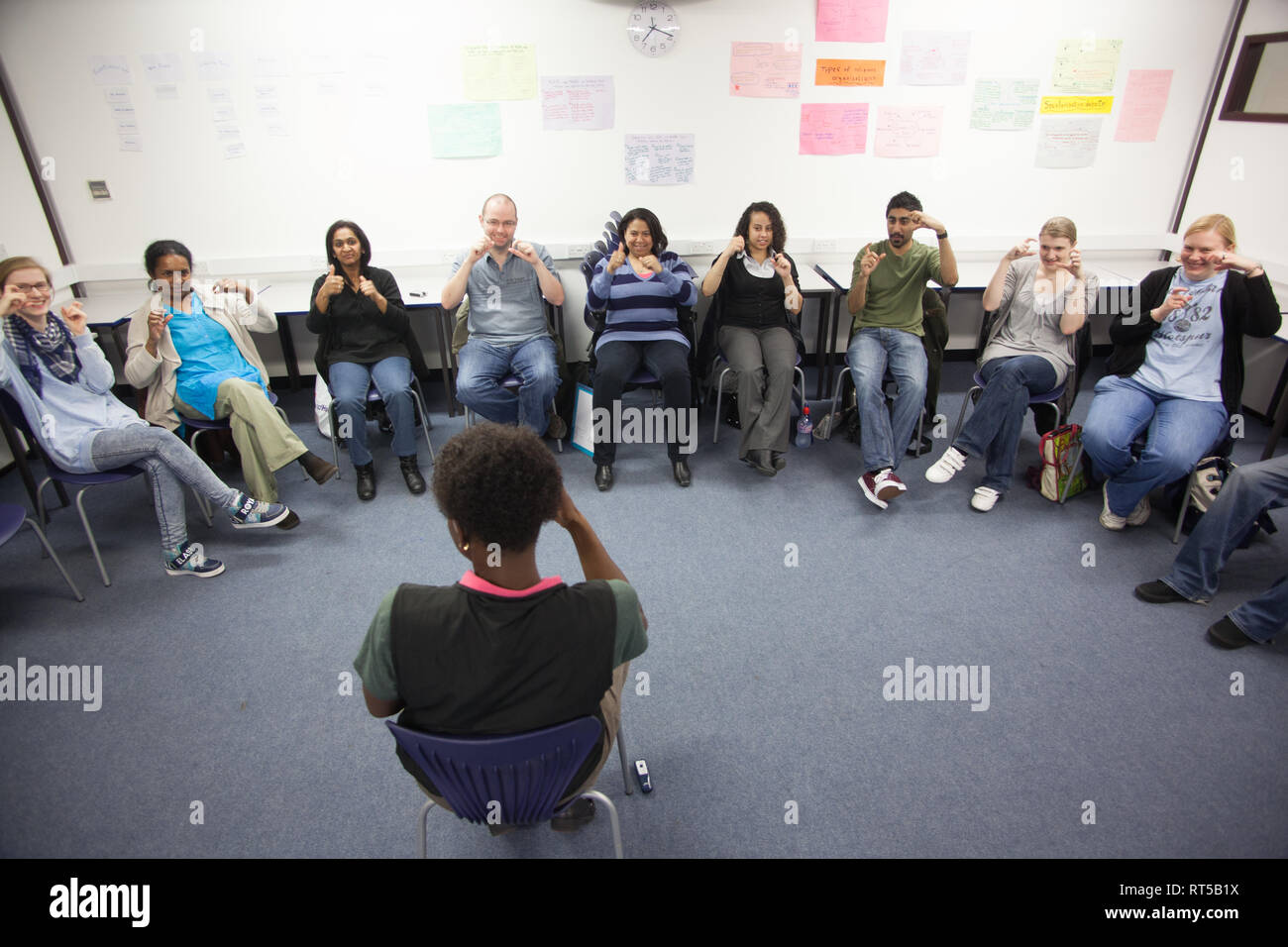 adults in a further education college learning how to use sign language ...