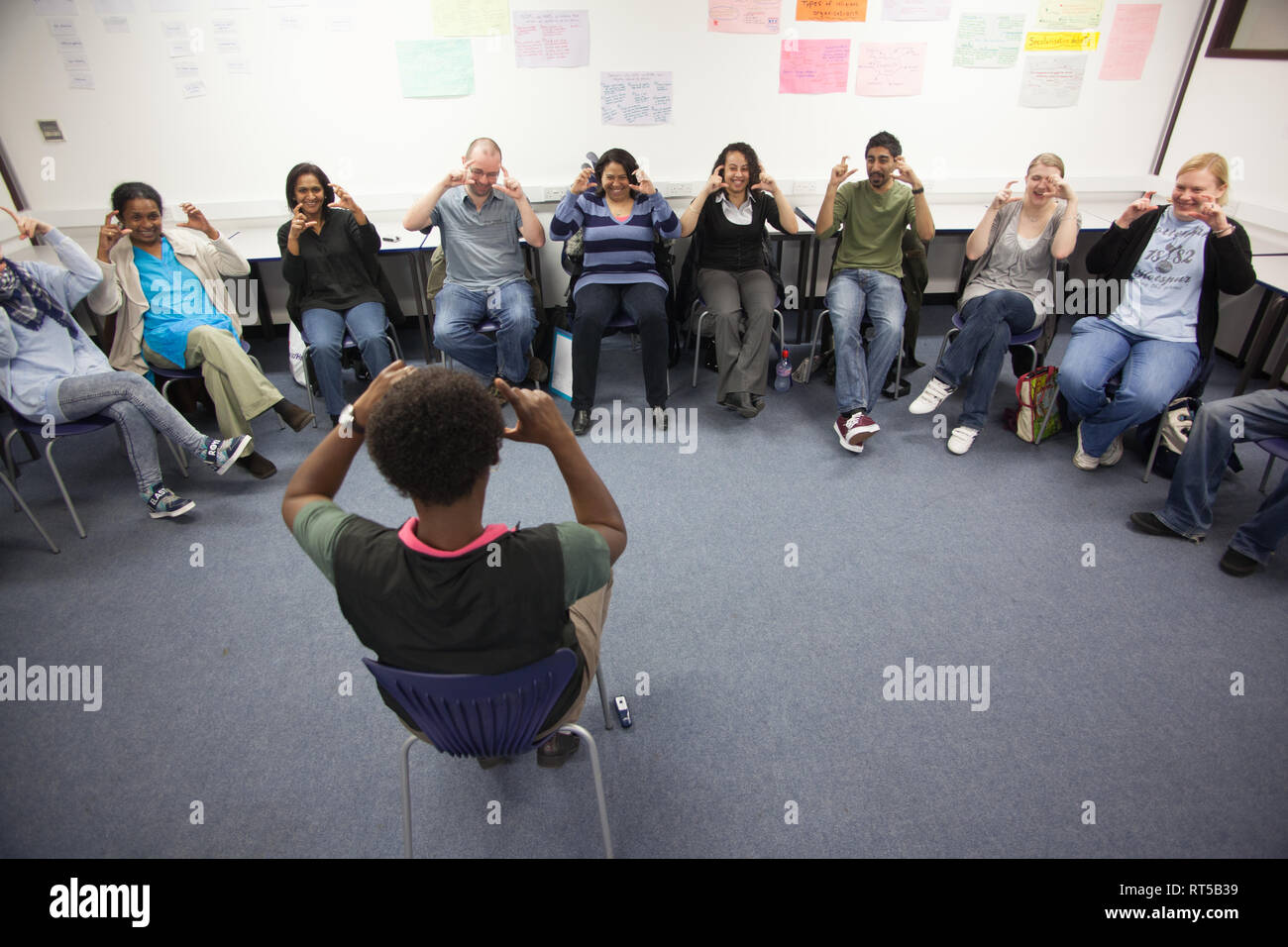 adults in a further education college learning how to use sign language ...