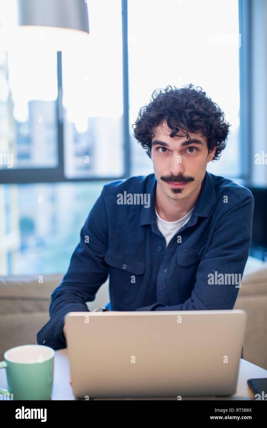 Portrait confident man working at laptop Stock Photo - Alamy Portrait confident man working at laptop Stock Photo - Alamy