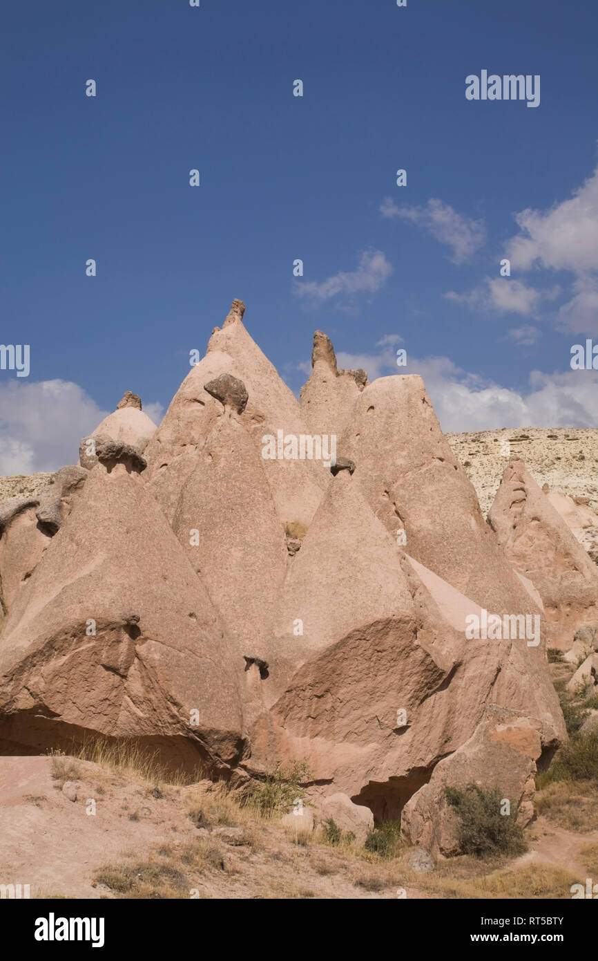 Pedestal and cone shaped eroded rock formations of hardened volcanic ...