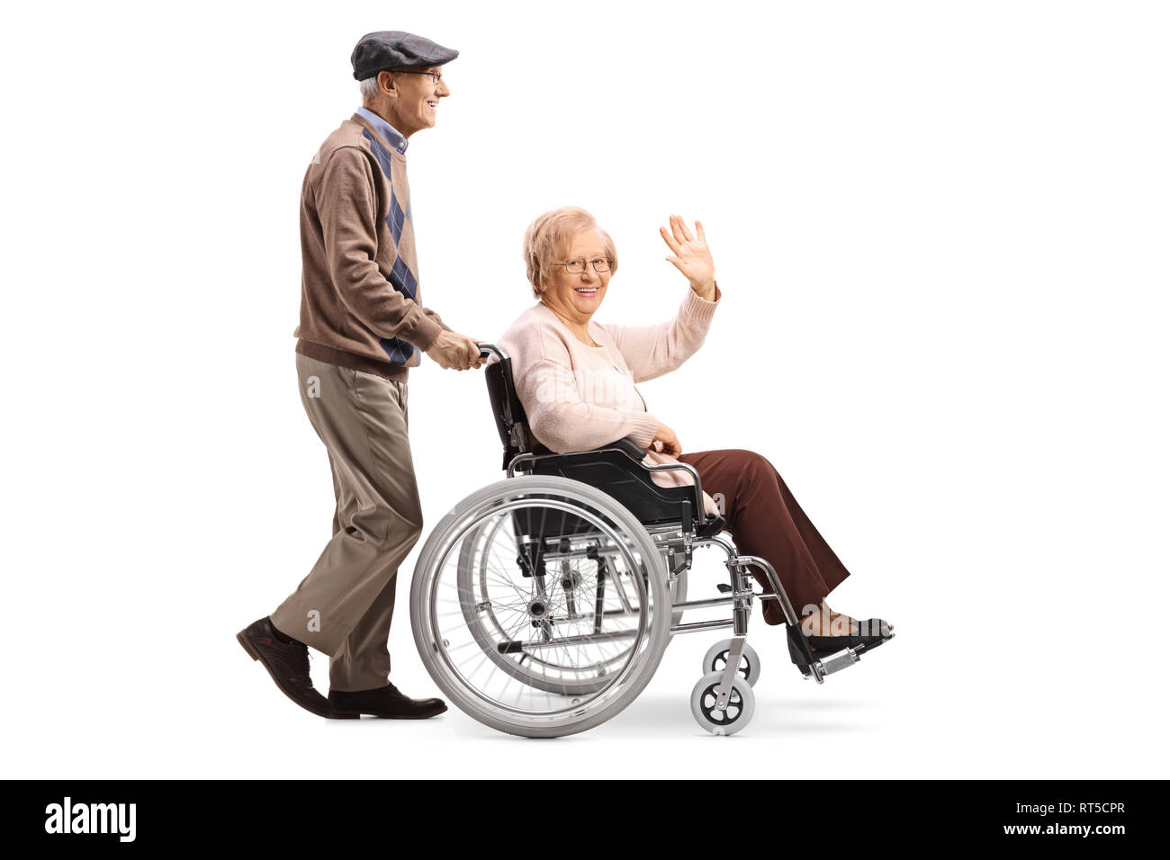 Full length profile shot of a senior man pushing a senior woman in a ...