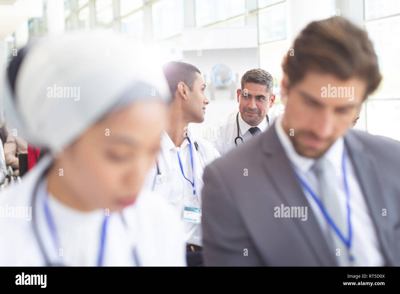 Male doctors interacting with each other during seminar Stock Photo - Alamy