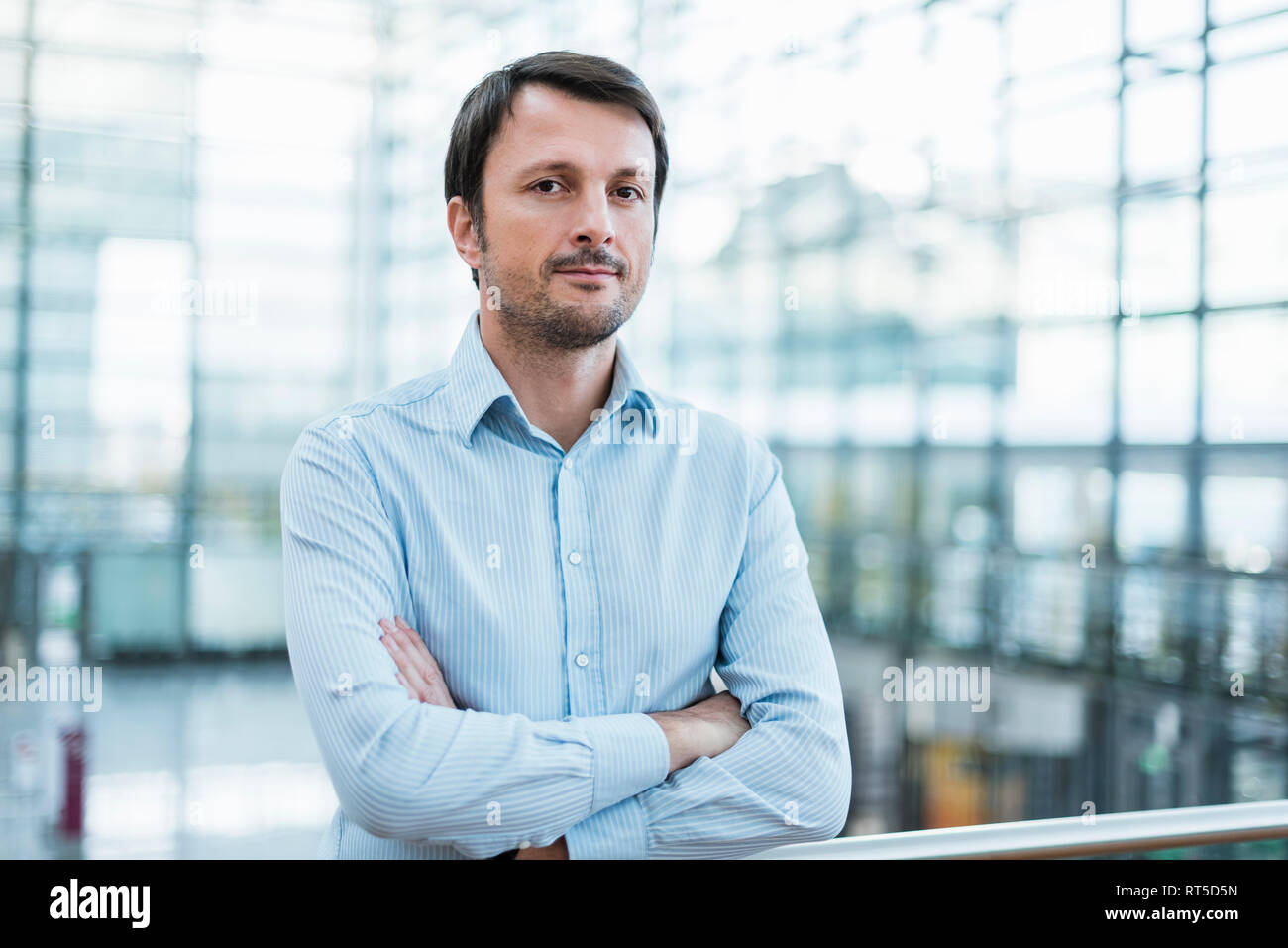 Portrait confident businessman arms hi-res stock photography and images ...