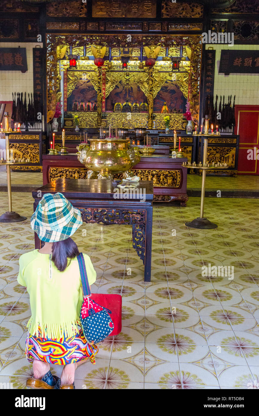George Town, Penang, Malaysia. Visitor Praying in Prayer Hall, Altar ...